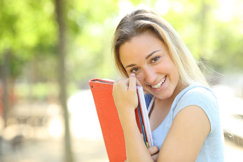 Timid Teenage Student Looking at Camera Stock Image - Image of folder ...