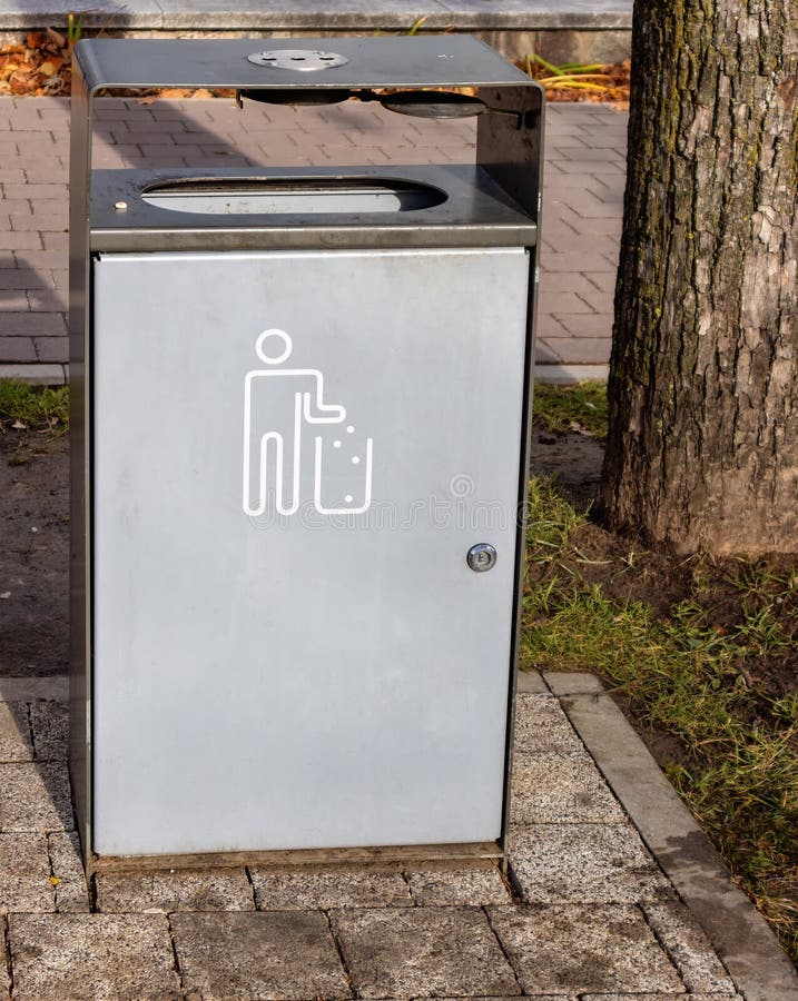 Tin Bin on a Tile in the Park Stock Photo - Image of metal, garbage ...