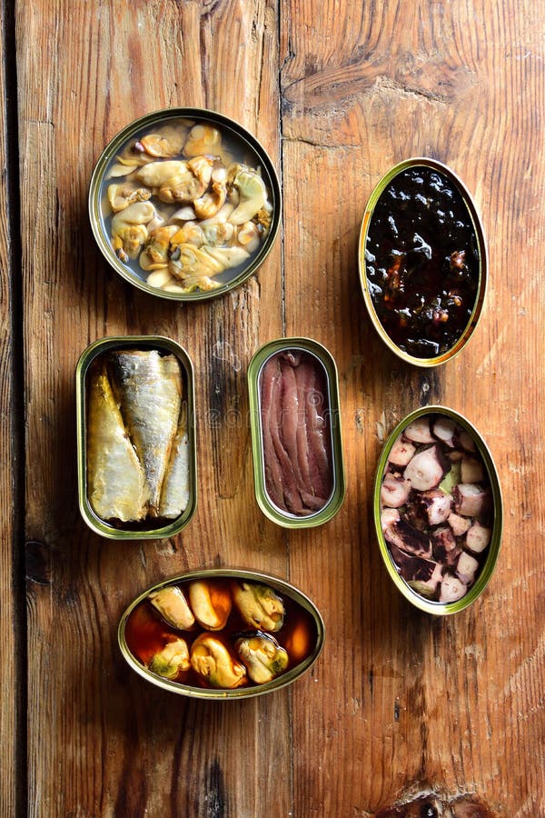 Tin cans on a table stock photo. Image of collection - 114653770