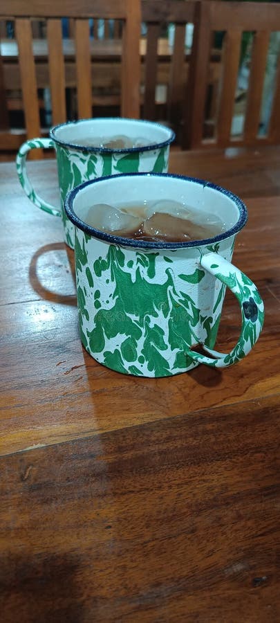 Tin Cup Filled with Iced Tea Stock Image - Image of iron, dishware ...