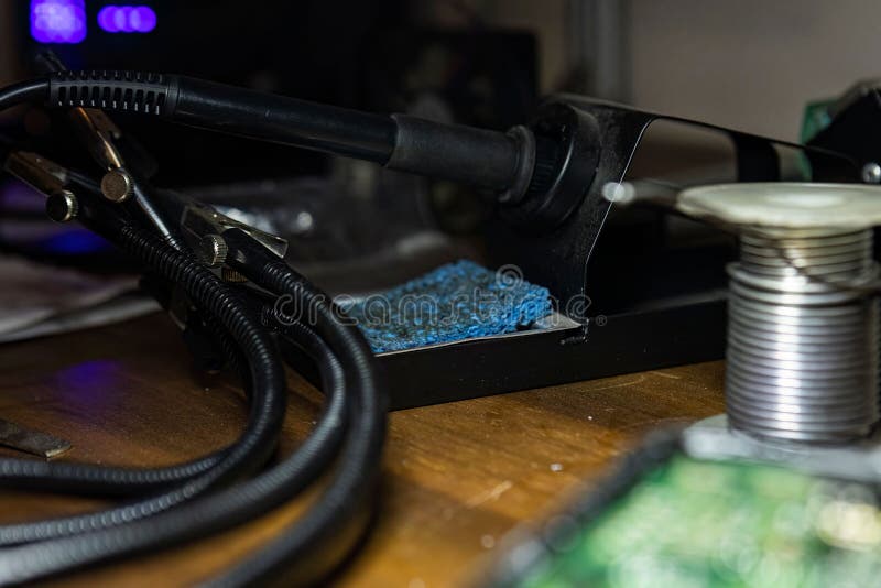 Tin-gun in the workbench stock photo. Image of board - 259043060