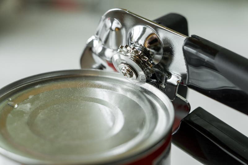 Tin Opener Opening a Can in a Kitchen Stock Photo - Image of kitchen ...