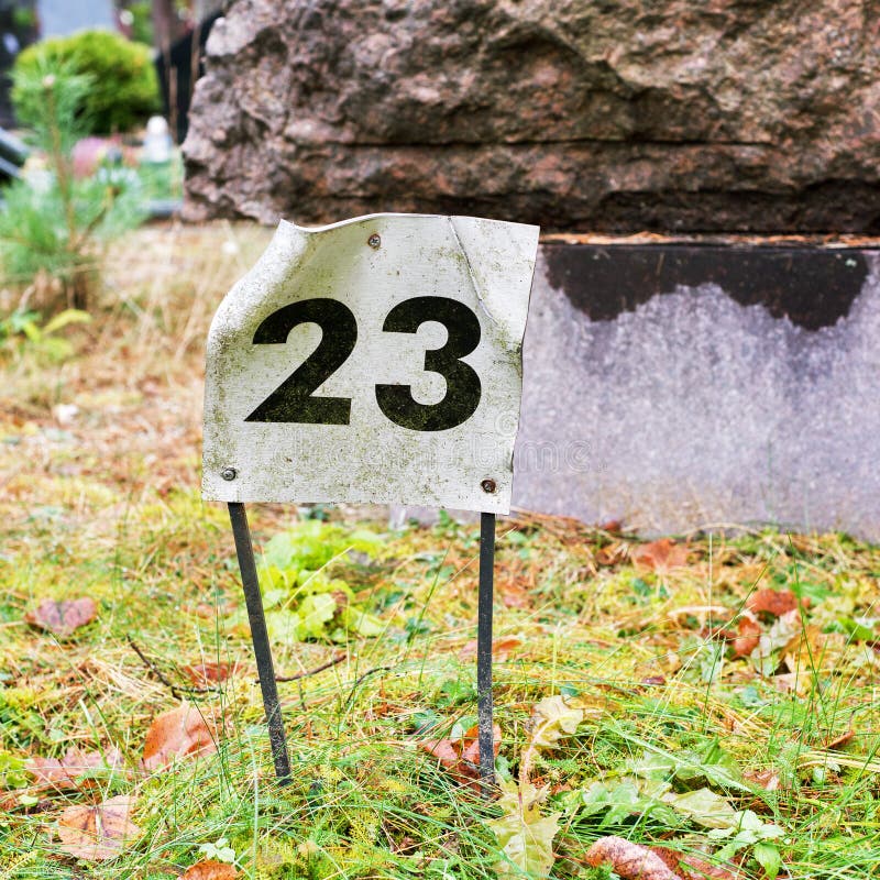 Plate with a Number 23 Sticked into the Ground. Stock Image - Image of ...