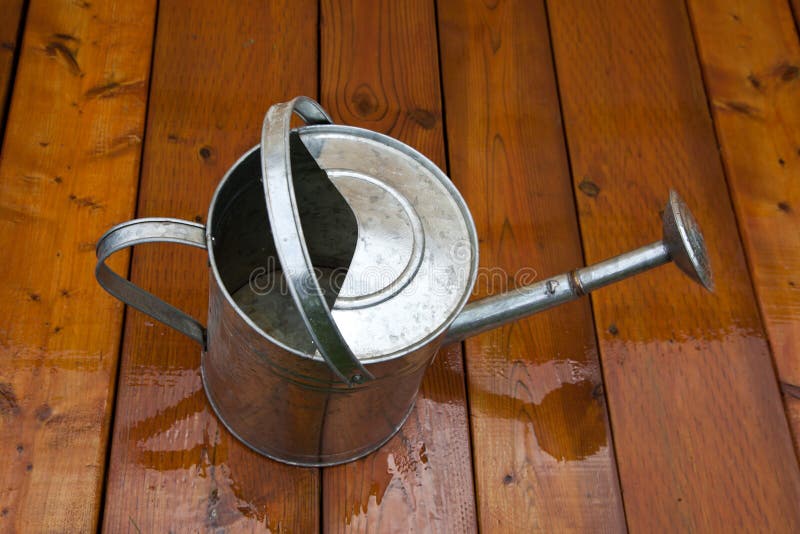 Tin Sprinkler on the Brown Boards Stock Photo - Image of texture ...