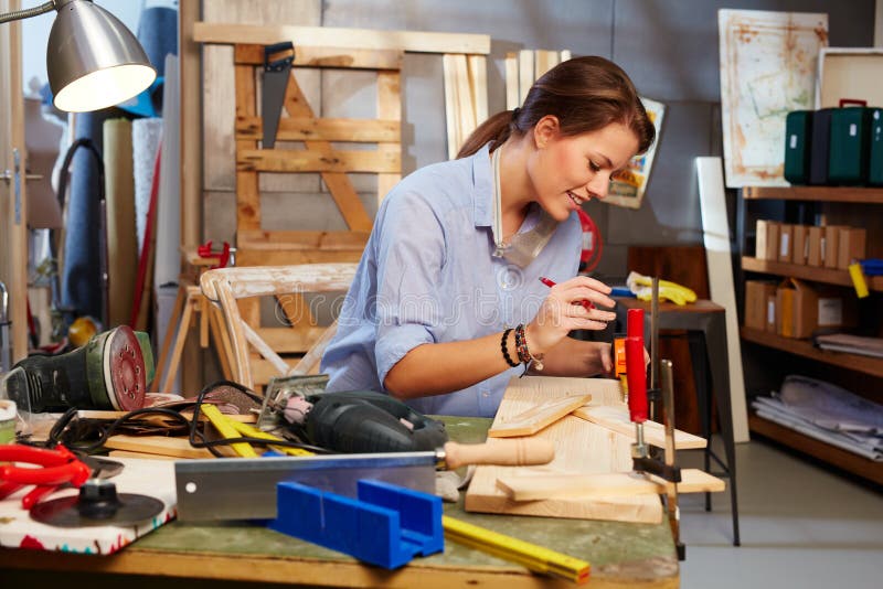 Tinkering woman stock image. Image of focus, clothing - 85054971