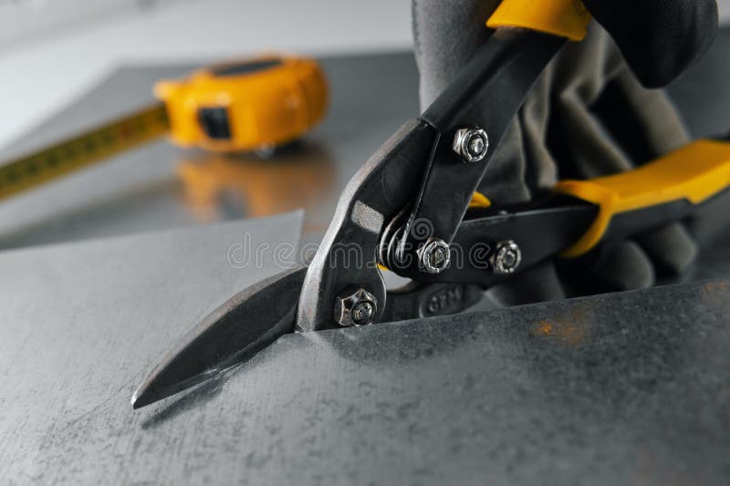 Tinsmith Cutting Metal Sheet with Tin Snips Stock Image - Image of ...