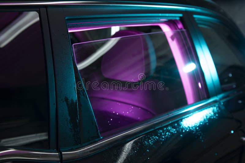 Tinting Car Windows in Neon Light.Window Film for the Car Stock Image ...