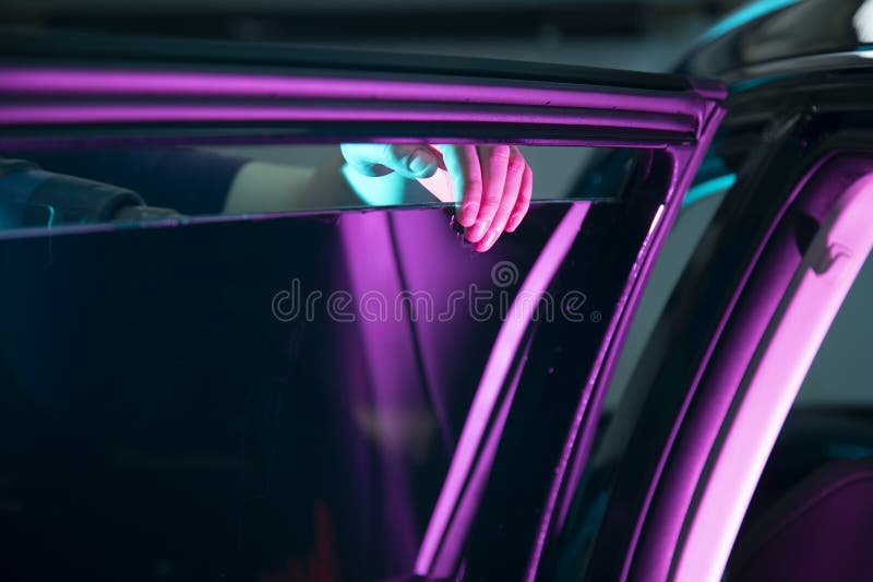 Tinting Car Windows in Neon Light.Window Film for the Car Stock Photo ...