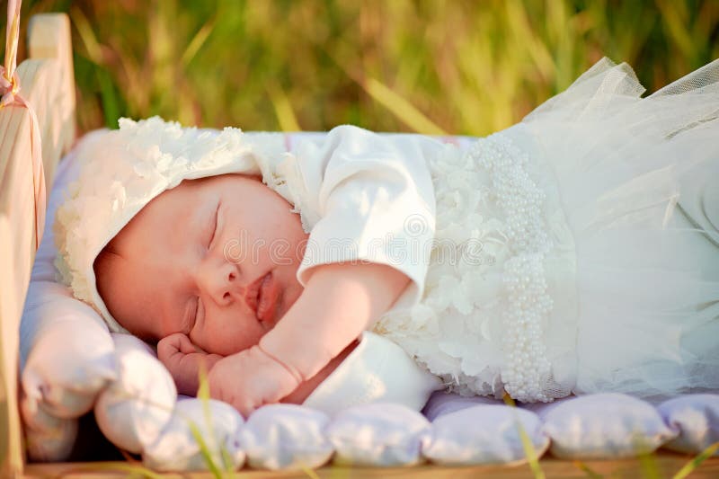 Tiny Baby Asleep in His Crib in Lace Bonnet Stock Image - Image of ...