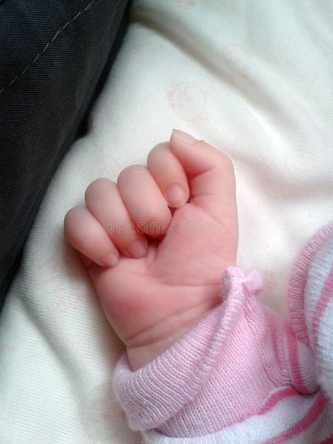 A tiny baby`s hand stock image. Image of closeup, babies - 137583693