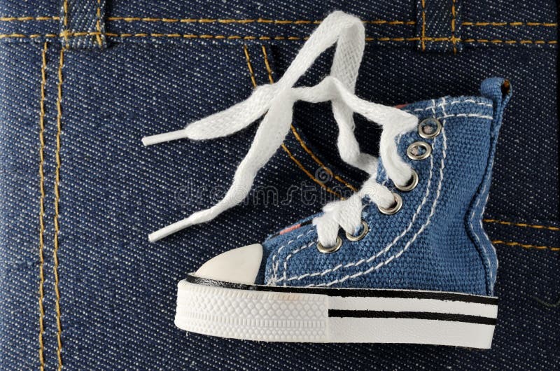 Tiny Blue Shoe on Denim Background Stock Photo - Image of casual, tiny ...
