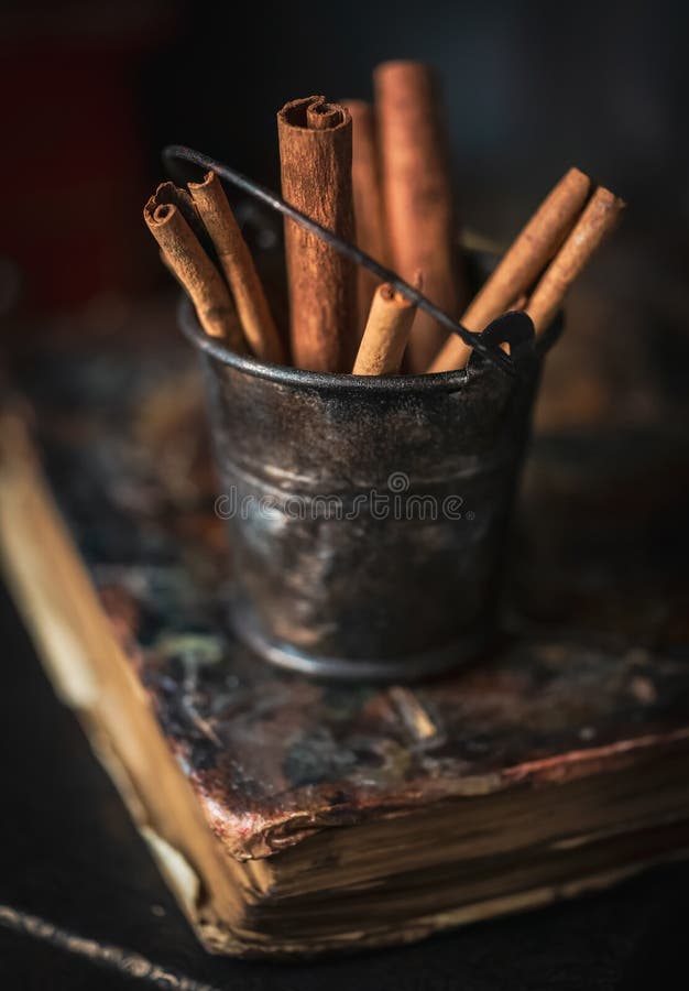 Tiny Bucket with Cinnamon Sticks on Rustic Wooden Background Stock ...