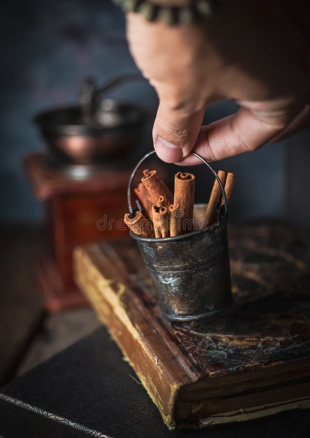 Tiny Bucket with Cinnamon Sticks on Rustic Wooden Background Stock ...
