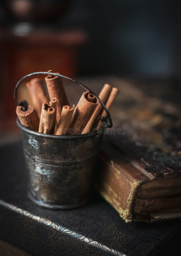 Tiny Bucket with Cinnamon Sticks on Rustic Wooden Background Stock ...