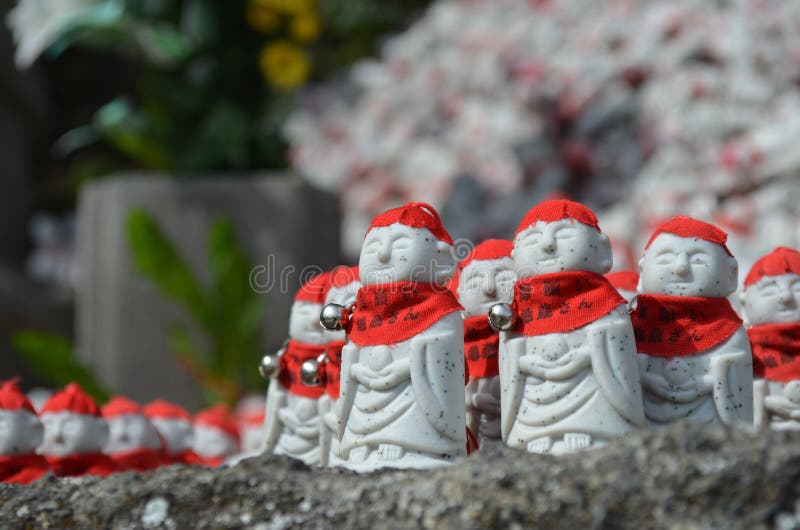 Tiny buddhist statues stock image. Image of japanese - 330358301