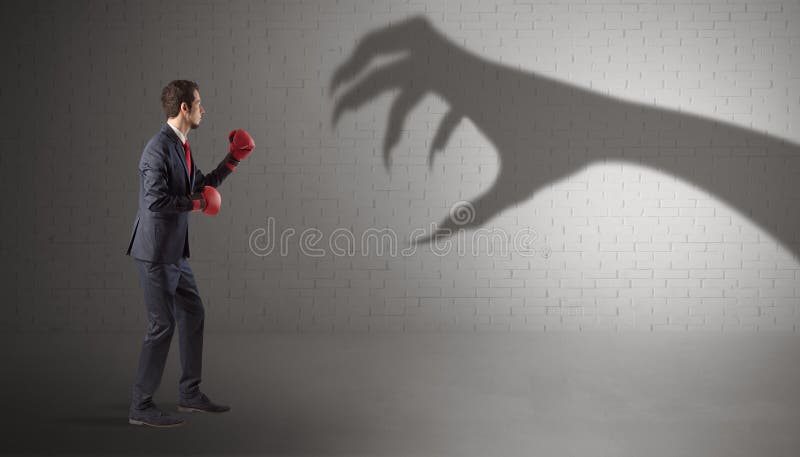 Businessman Fighting with Scary Hand Shadow Stock Image - Image of ...