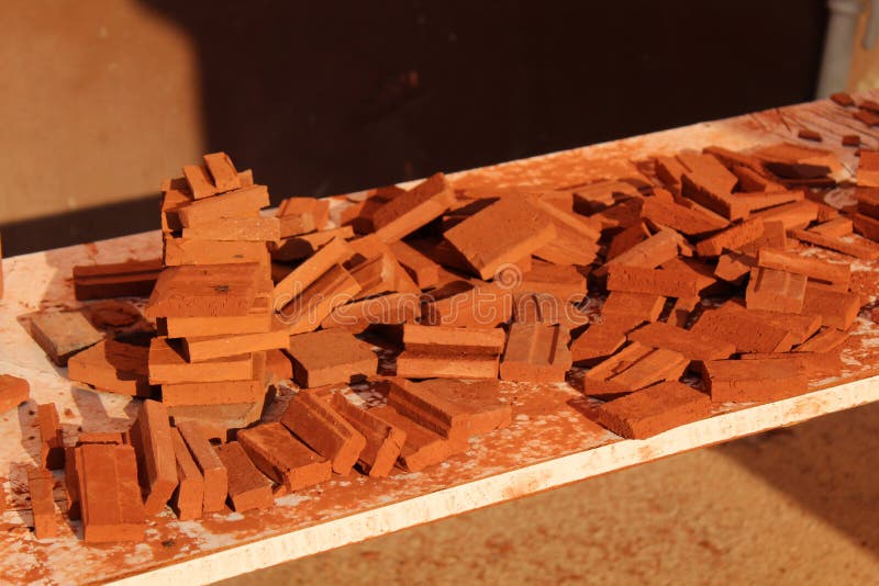 Tiny Dark Orange Bricks on a Table at Sunset Color Stock Image - Image ...
