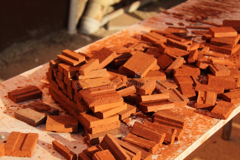Tiny Dark Orange Bricks on a Table at Sunset Color Stock Image - Image ...