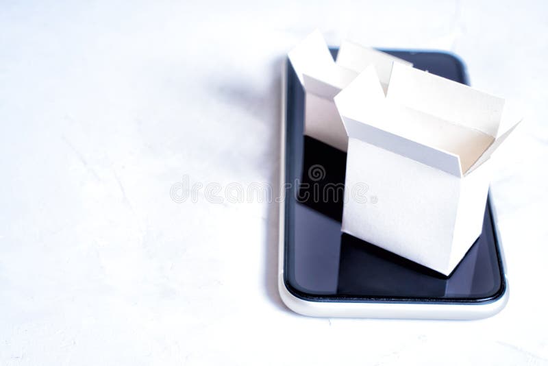 Tiny Delivery Boxes Placed on a Smartphone Stock Photo - Image of white ...