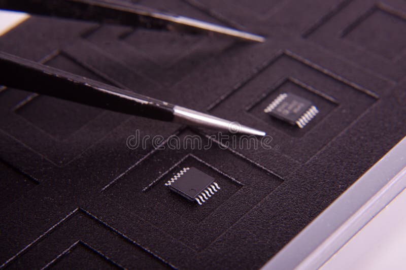 Tiny Electronics Chip Component on the Black Antistatic Mat Stock Image ...