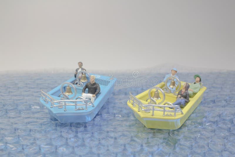 A Tiny Figure with a Small Boat Stock Photo - Image of situation, size ...