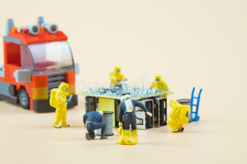 Tiny Figures of Chemical Team in Hazmat Suits Examining Stock Image ...