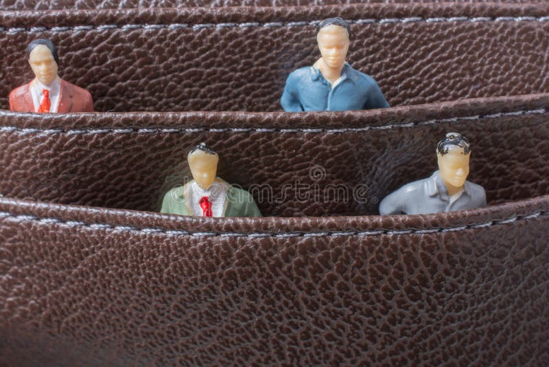Tiny Figurine of Men Model in Pockets Stock Photo - Image of business ...