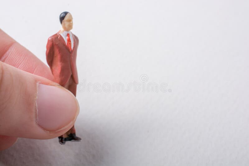 Tiny Figurine of Man Model in Hand Stock Image - Image of talking ...