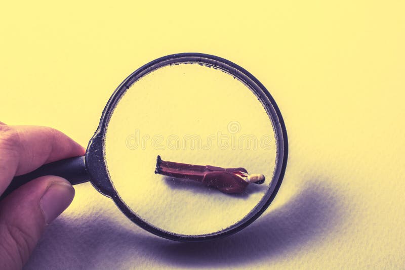 Tiny Figurine of Man Model Under Magnifying Glass Stock Image - Image ...