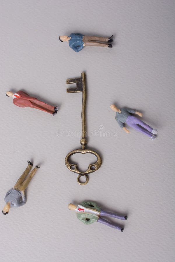 Tiny Figurine of Man Model and Retro Key Stock Image - Image of figures ...