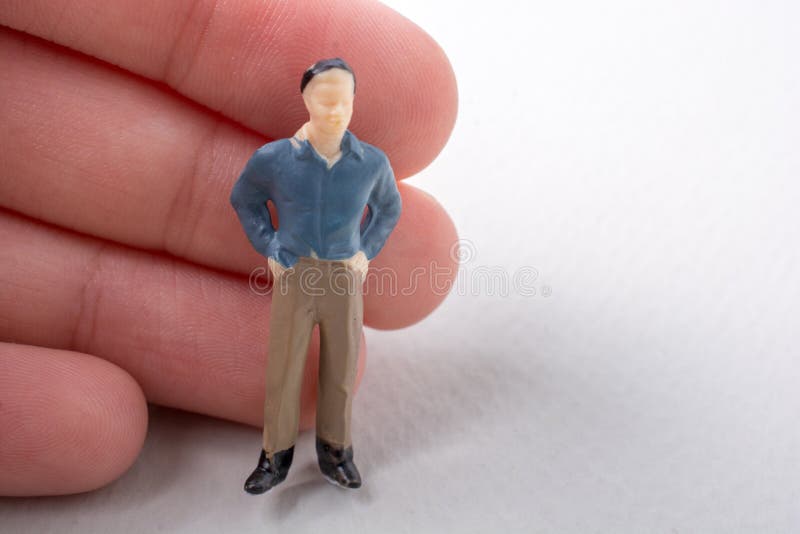 Tiny Figurine of Man Model in View Stock Photo - Image of people, model ...