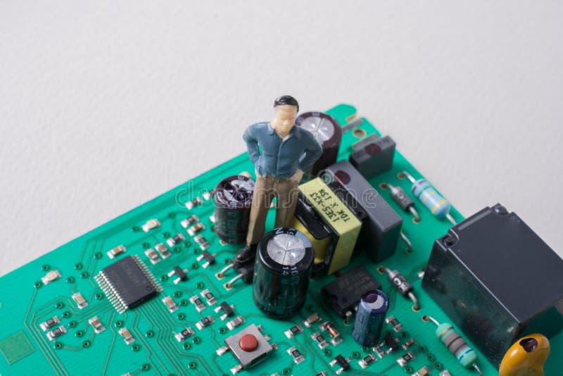 Tiny Figurine of Men Model on Circuit Board Stock Image - Image of ...
