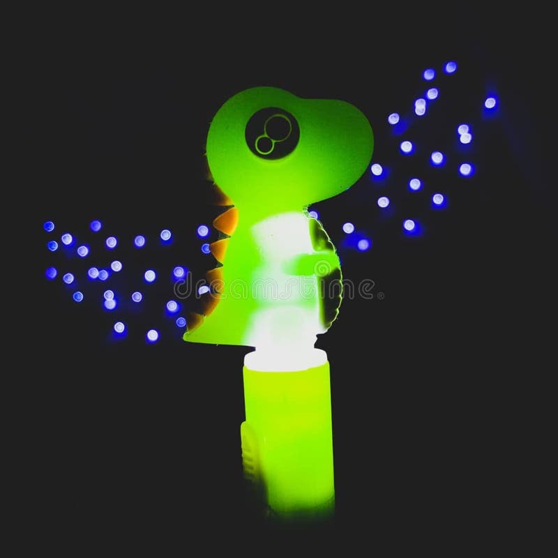 Tiny Green Rubber Dinosaur in Dark Lighting Room Stock Photo - Image of ...