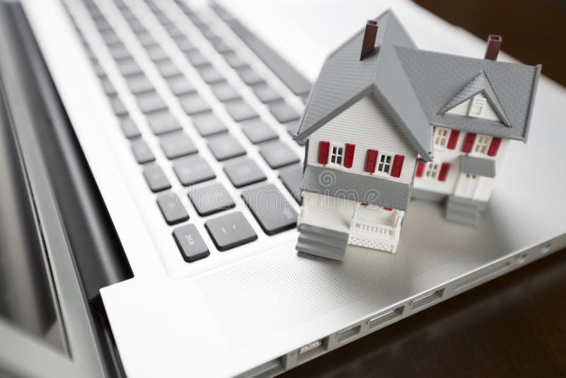Tiny Miniature House on a Laptop Computer Stock Photo - Image of ...