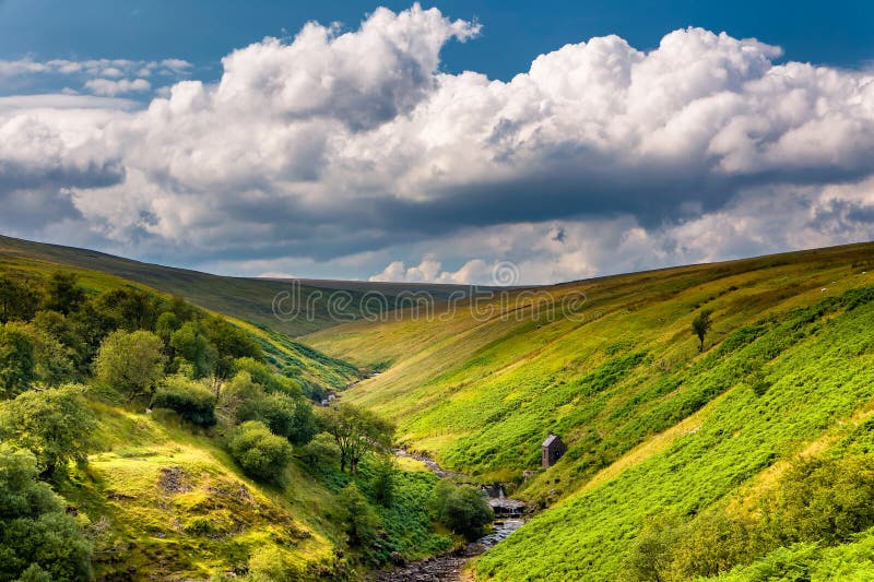 A Tiny Mountain Shelter in a Lush, Green, Remote Landscape Stock Photo ...