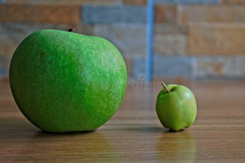 Tiny and Normal Apple stock image. Image of apple, wooden - 80900839