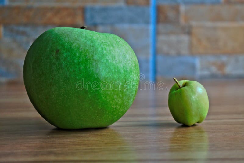 Tiny and Normal Apple stock photo. Image of fruit, normal - 81009968