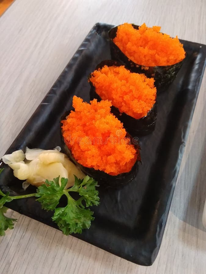 Tiny Orange Fish Eggs Onigiri with Preserved Ginger Stock Photo - Image ...