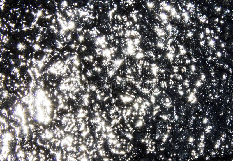 Tiny Patches of Light Shining through Dark Surface Stock Image - Image ...
