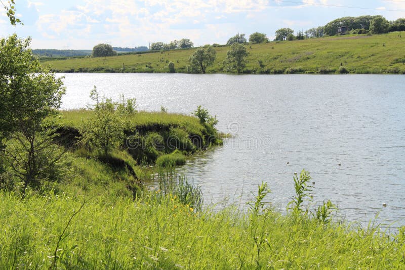 A Tiny Peninsula a Little Going into the Water of the Lake. Stock Photo ...