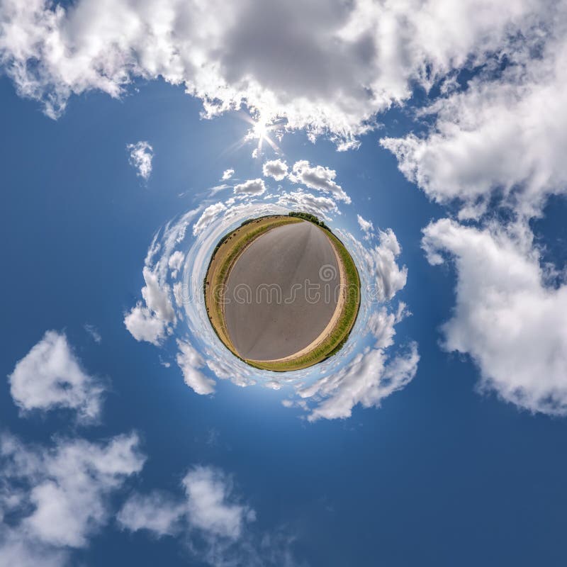 Tiny Planet in Blue Overcast Evening Sky with Beautiful Clouds with ...