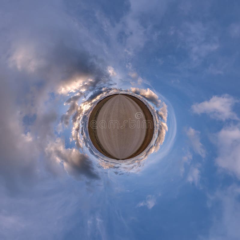 Tiny Planet in Blue Overcast Evening Sky with Beautiful Clouds with ...