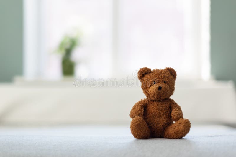 Tiny Plush Teddy Bear Toy Sitting on the Bed Stock Photo - Image of ...