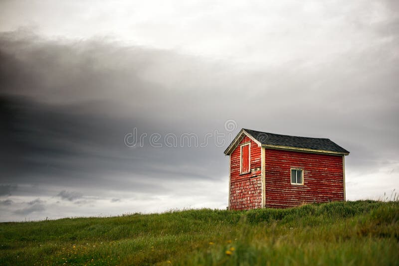 Tiny Red Building in Field with Dark Clouds Stock Image - Image of ...