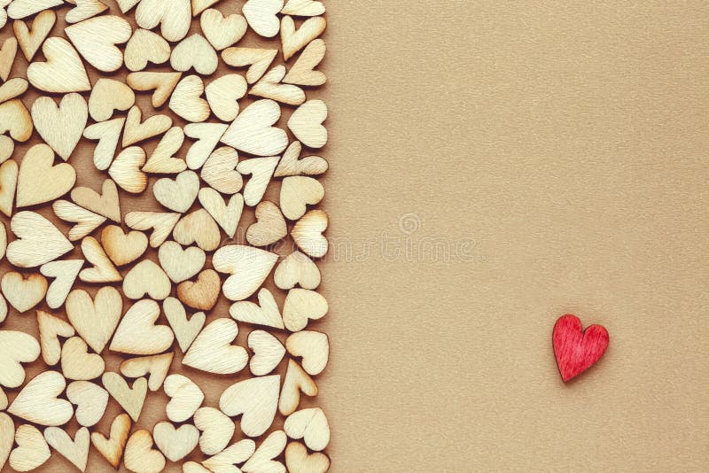 Tiny Scattered Wooden Hearts with One Single Red Heart and Blank Space ...