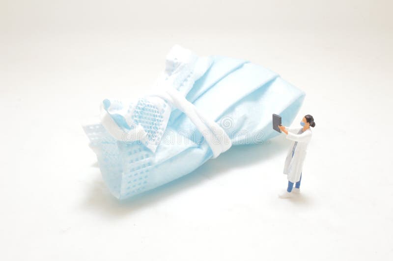 Tiny Scientist Examining Large Protective Face Mask Model Stock Image ...