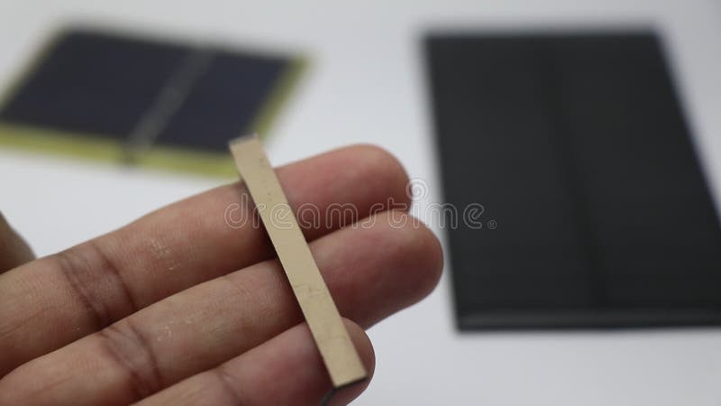 Tiny Solar Cell or Solar Panel in Hand with Varieties on Other Panels ...