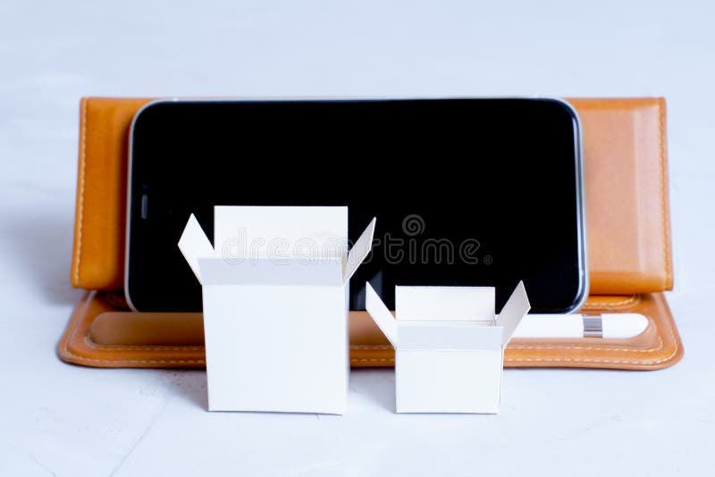 Tiny Unpacked Delivery Packages and Smartphone Stock Image - Image of ...
