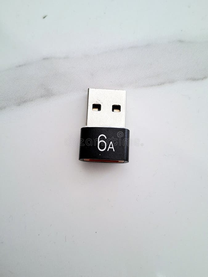 A Tiny USB Adapter on a White Surface Stock Photo - Image of data ...