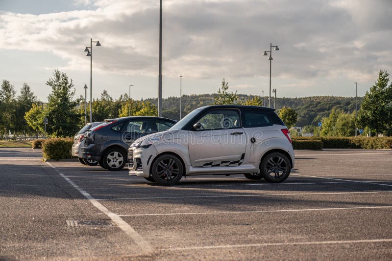 Tiny White Lieger Moped Car in a Parking Lot.. Editorial Photography ...